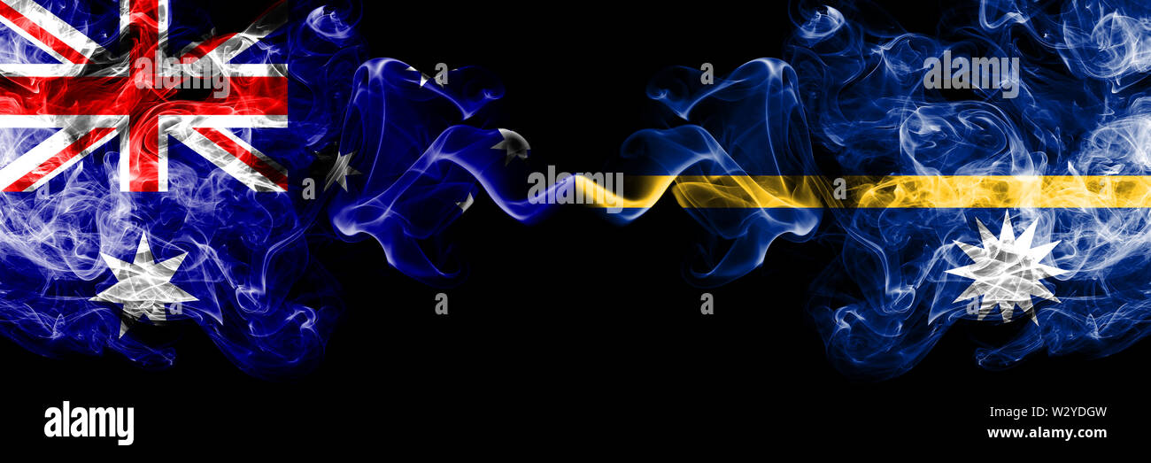 Australia vs Nauru smoky mystic flags placed side by side. Thick ...