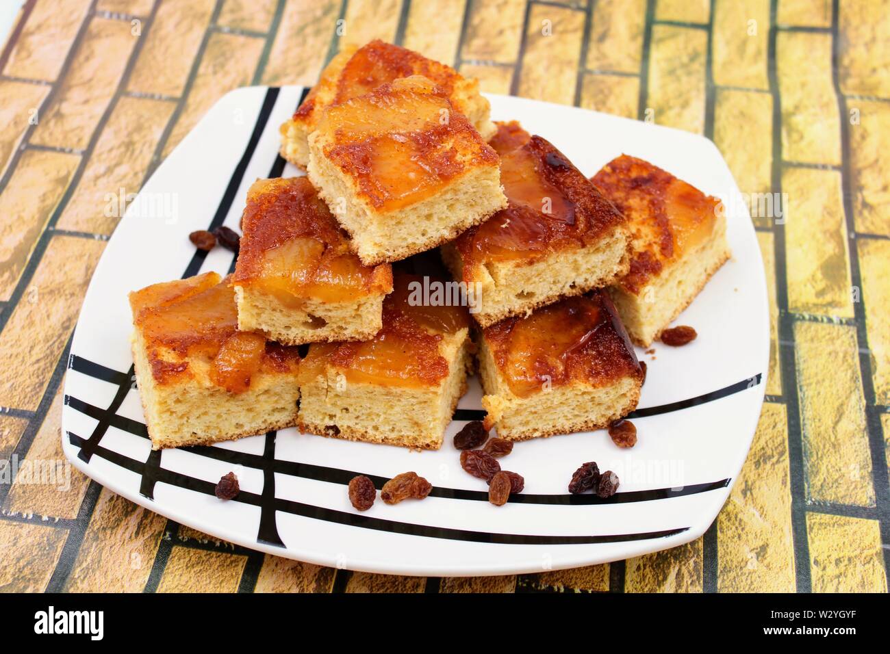 Rich and sweet sponge cake with caramelized apple Stock Photo - Alamy