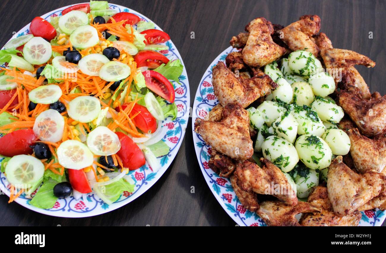 Plate with chicken , potatoes and crispy salad Stock Photo - Alamy