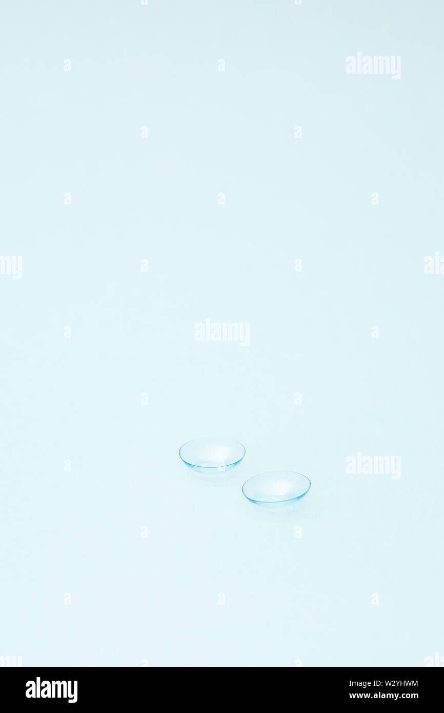 Contact Lenses in a Pastel Light Blue Background Stock Photo - Alamy