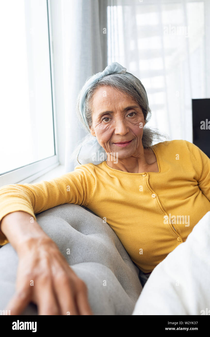 Woman inside a room smiling Stock Photo - Alamy