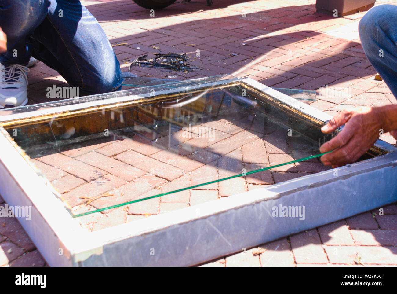 window maker at work after a code oranje storm hit the city of ...