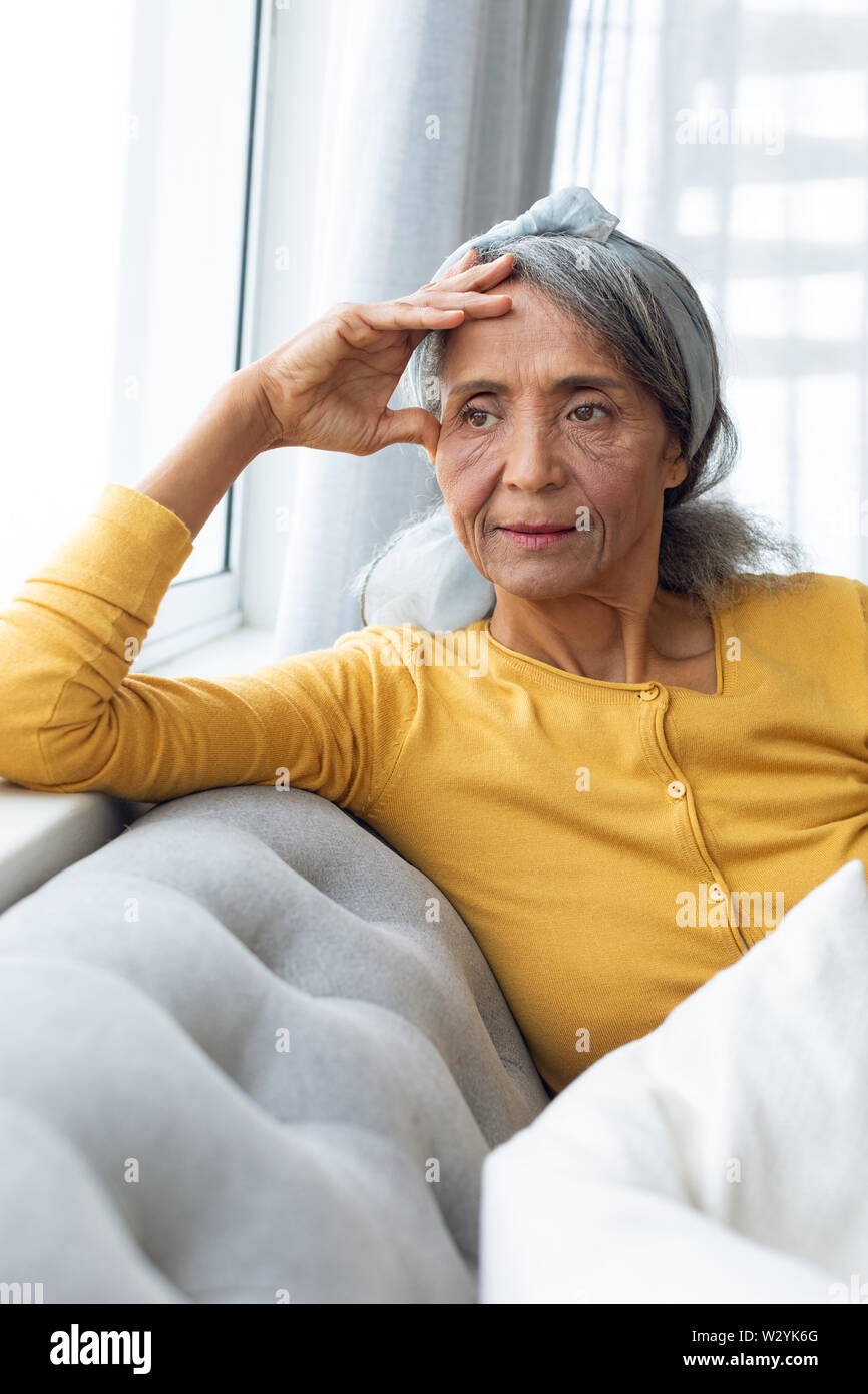 Woman inside a room thinking Stock Photo - Alamy