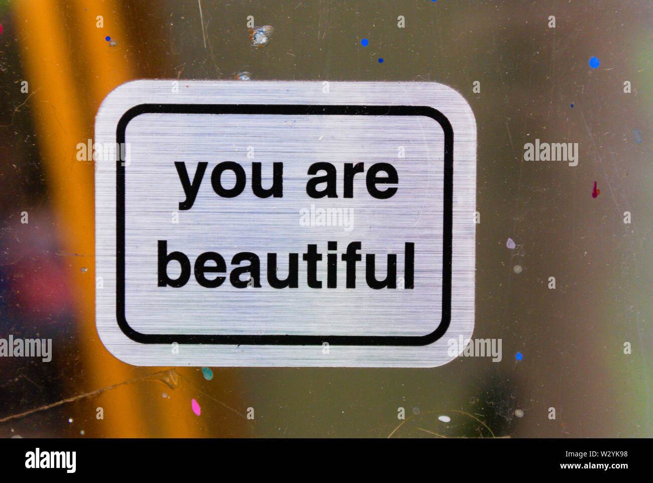 you are beautiful signs in the window of a artist painter Stock Photo ...