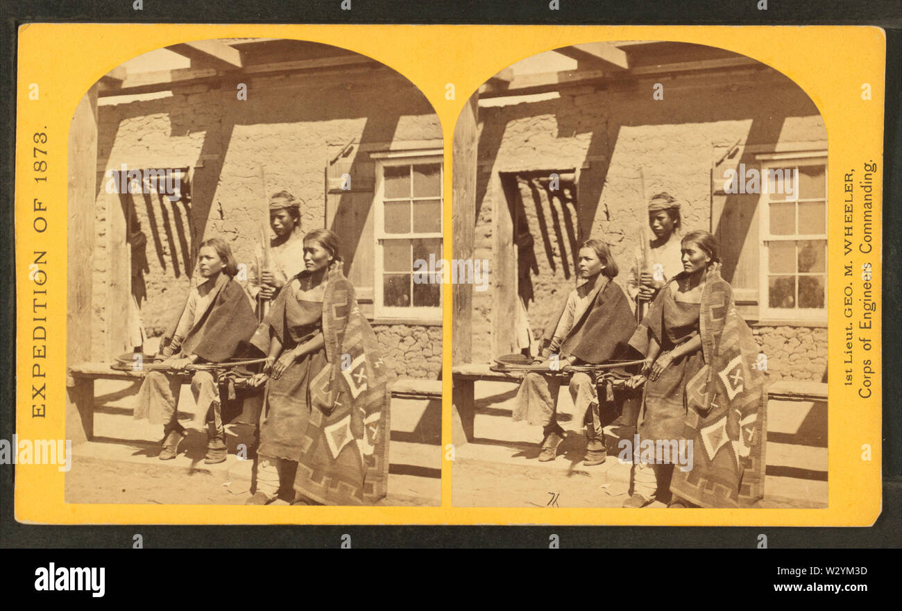 Navajo boys and squaw, in front of the quarters at old Fort Defiance ...