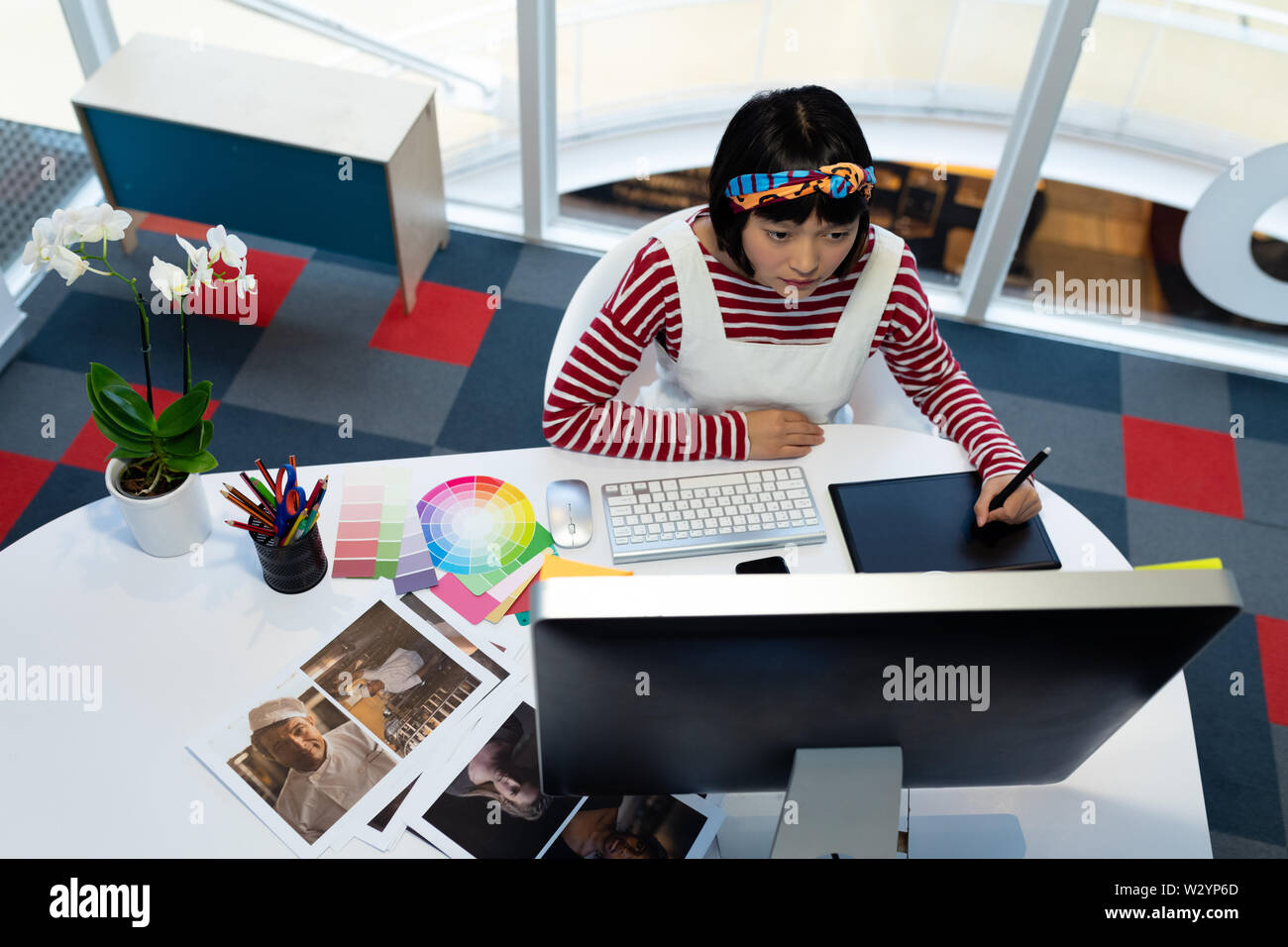 Female graphic designer using graphic tablet Stock Photo - Alamy