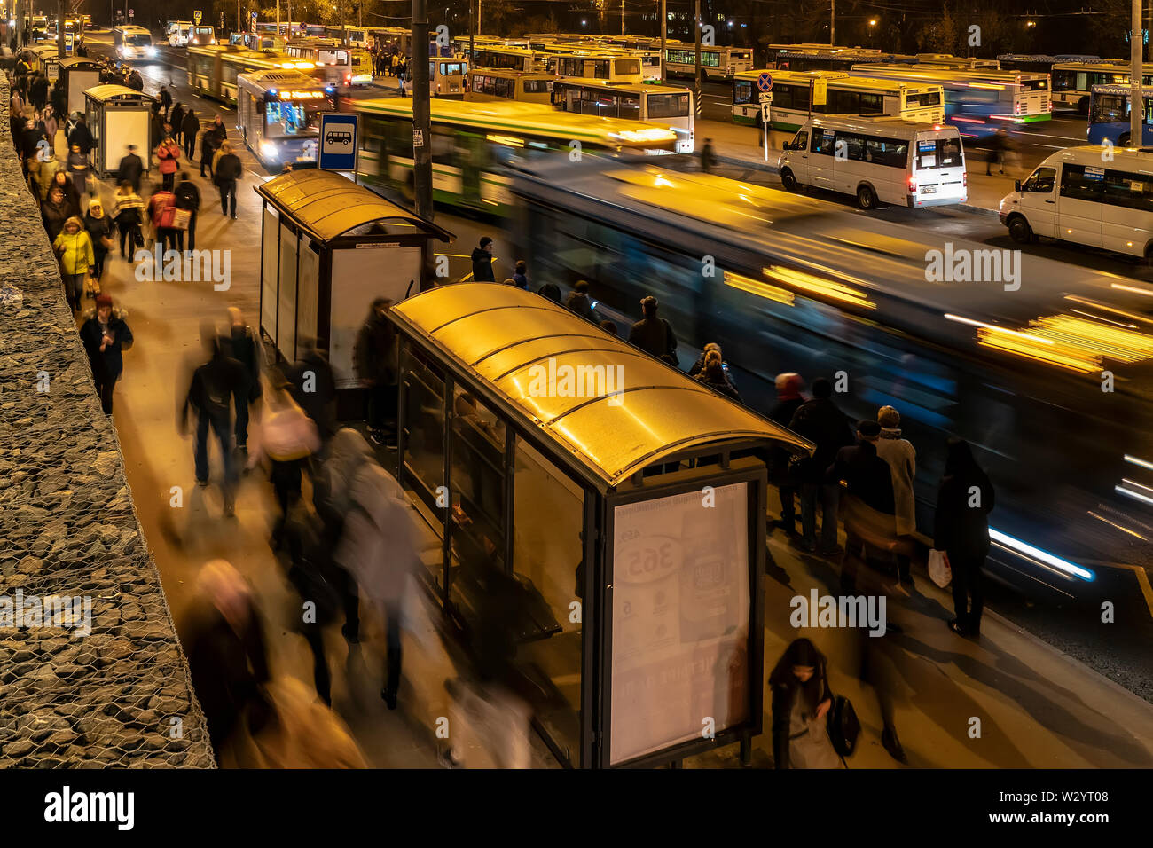 passengers waiting and boarding buses at the bus terminal Stock Photo ...