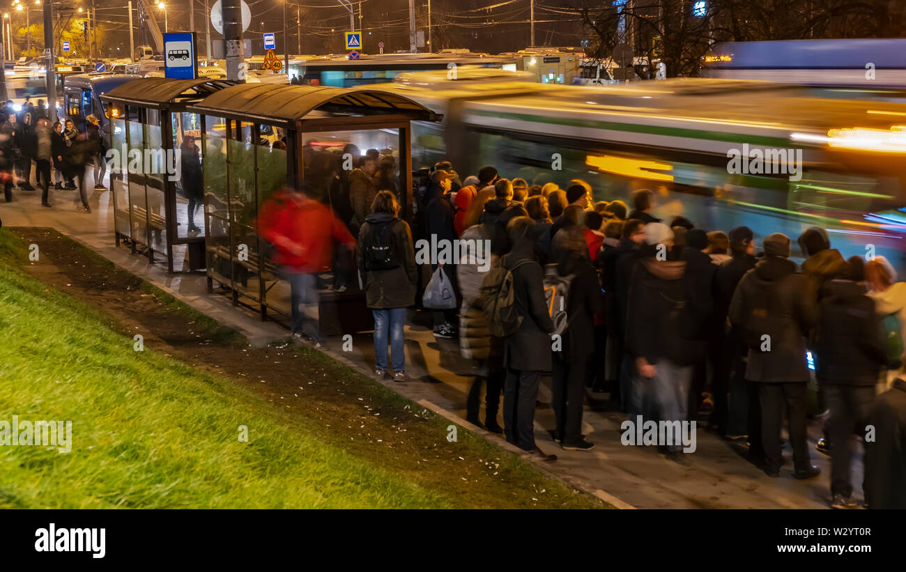 passengers waiting and boarding buses at the bus terminal Stock Photo ...