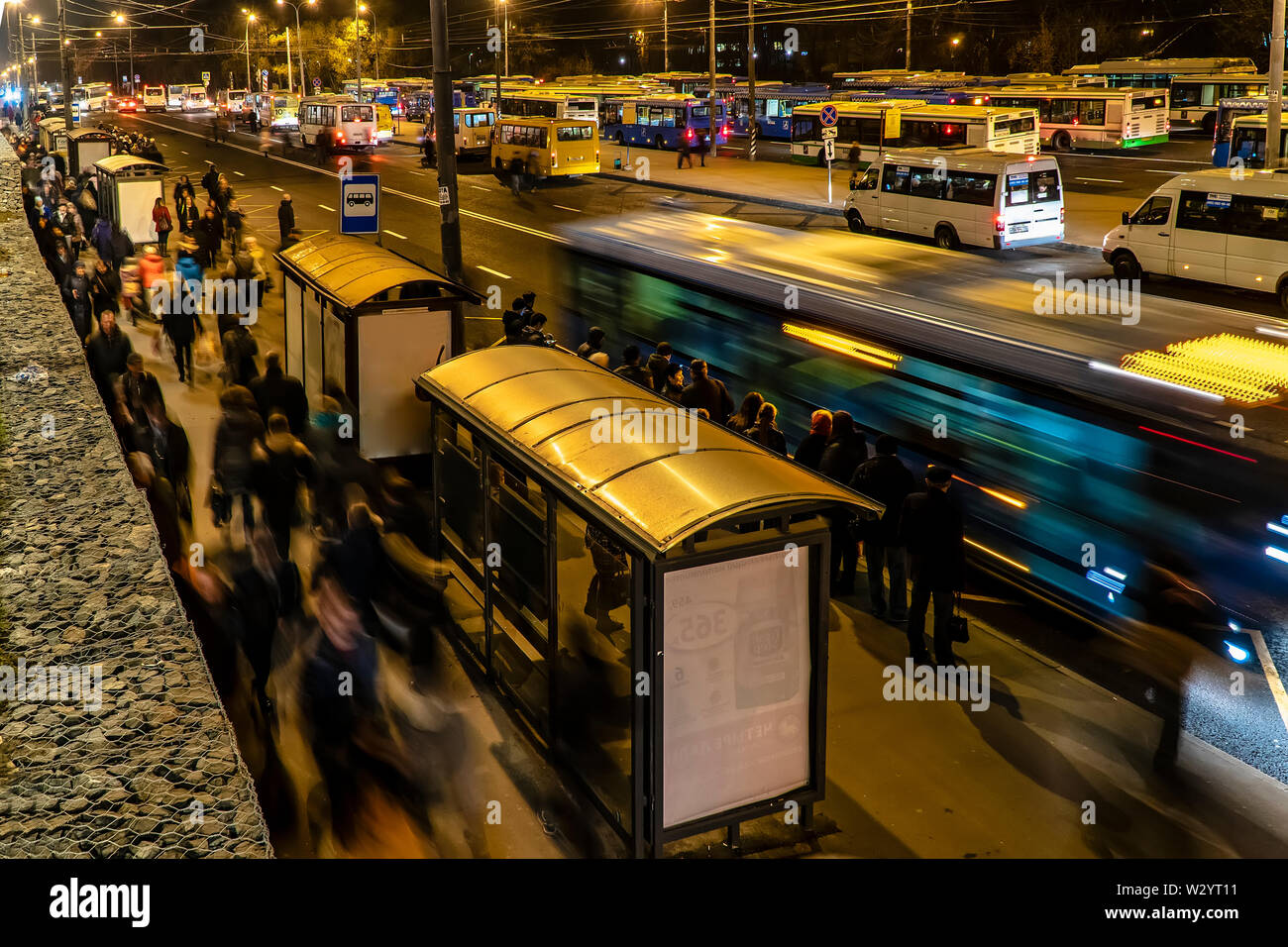passengers waiting and boarding buses at the bus terminal Stock Photo ...