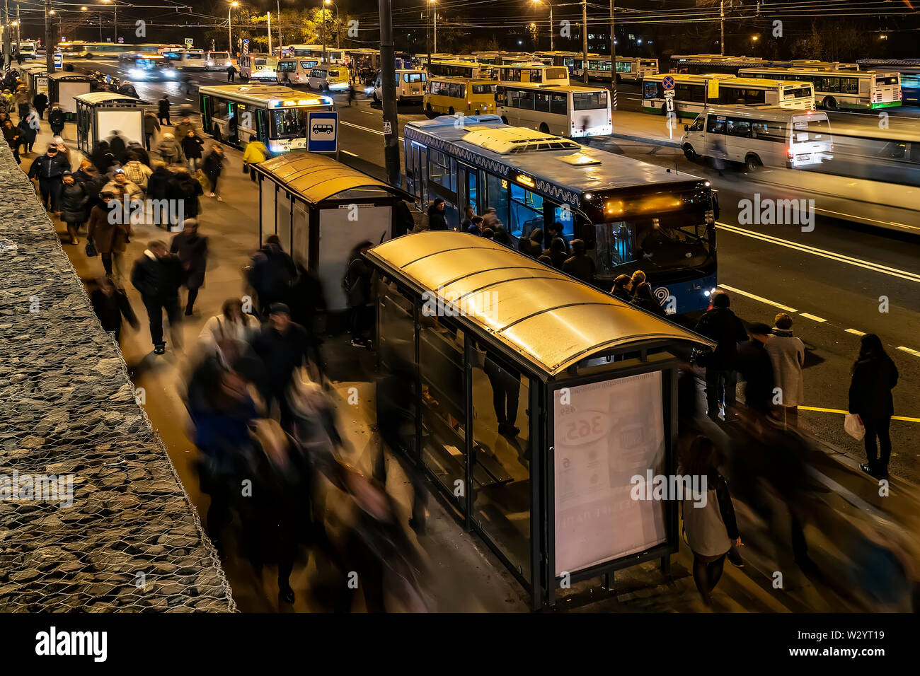 passengers waiting and boarding buses at the bus terminal Stock Photo ...