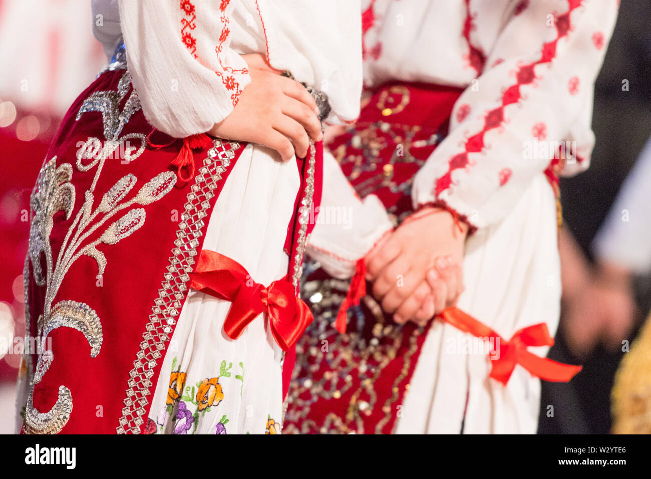Close up on hands of young Romanian dancers perform a folk dance in ...