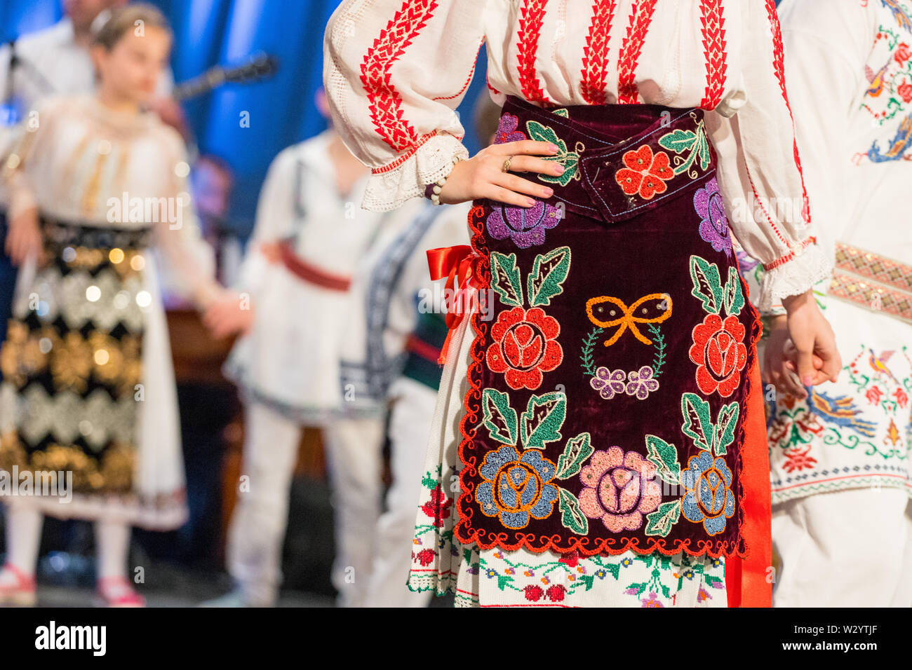 Close up s of young Romanian dancers perform a folk dance in ...