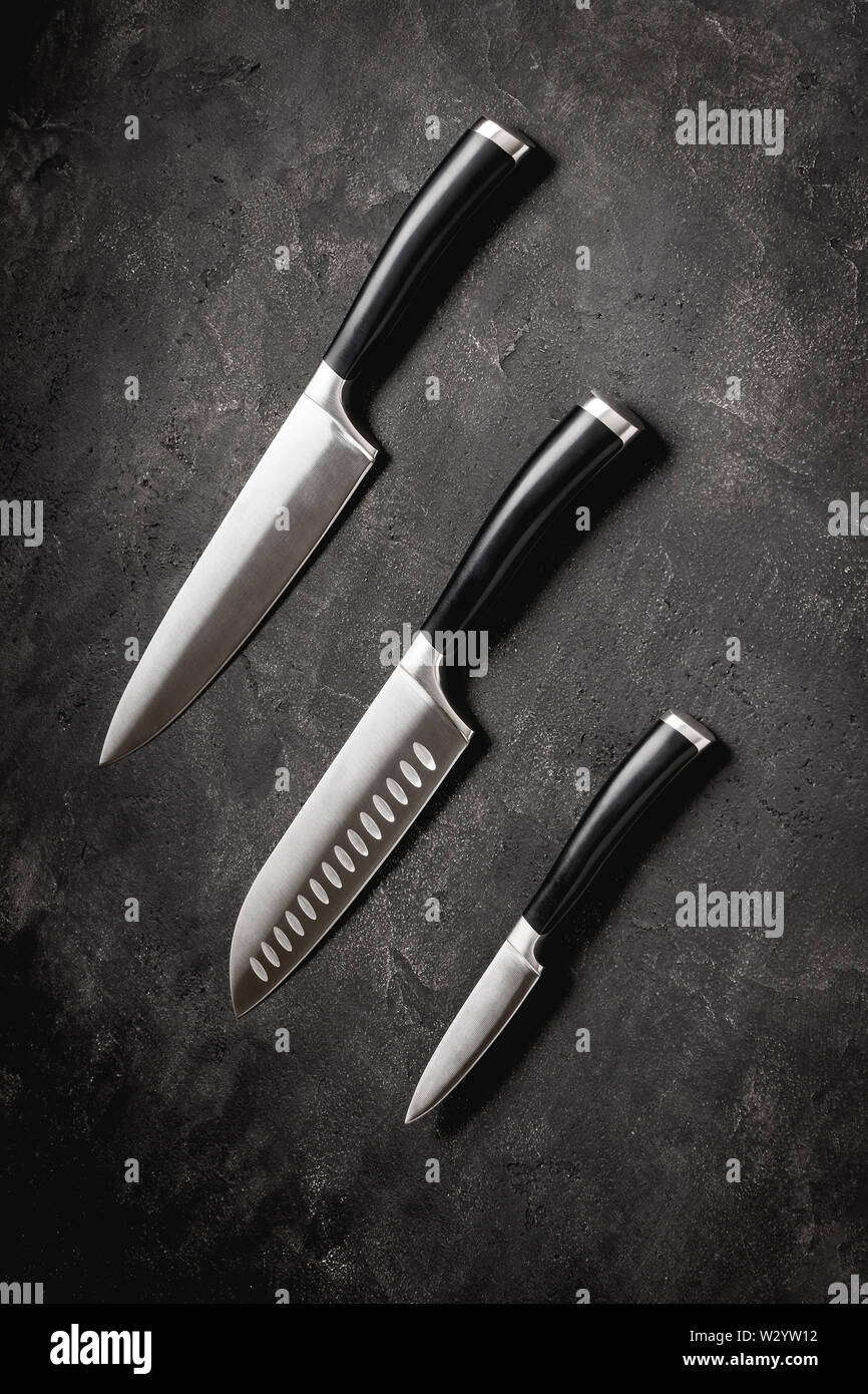 Modern Kitchen Knives Set on Dark Stone Background. Chef's Knives ...