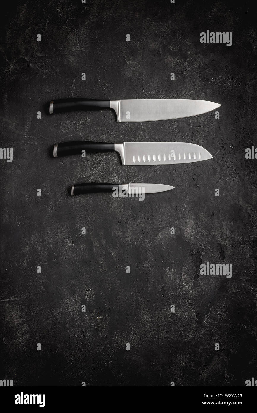 Modern Kitchen Knives Set on Dark Stone Background. Chef's Knives ...
