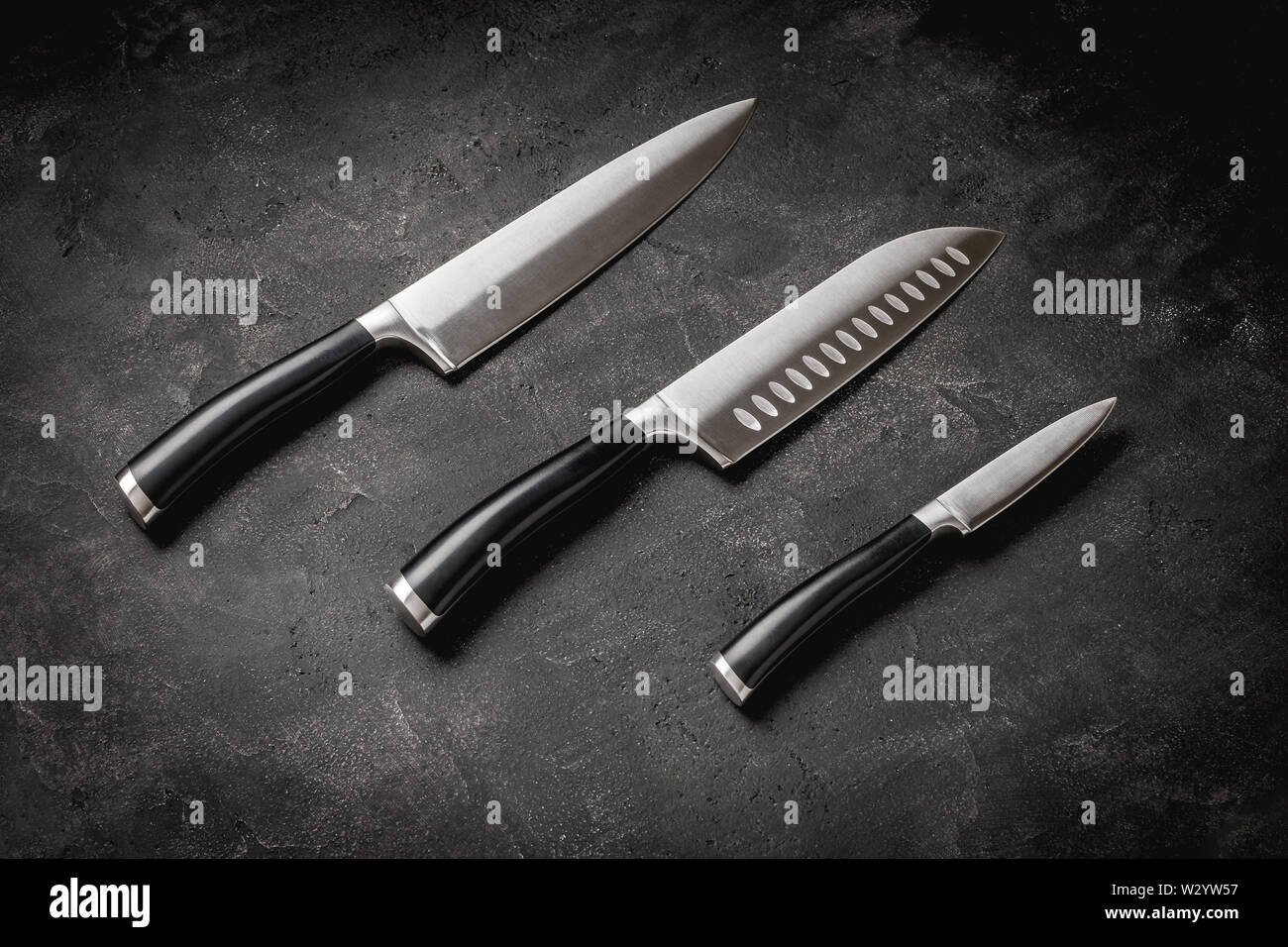 Modern Kitchen Knives Set on Dark Stone Background. Chef's Knives ...