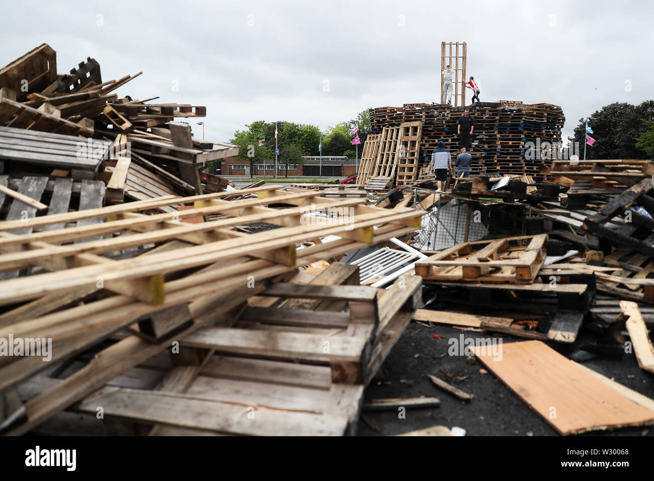 People add to the 11th night bonfire at Avoniel Leisure Centre as ...