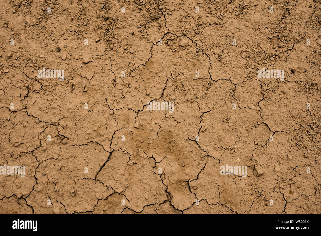 Cracked Dry Clay Ground Soil Background and Texture Stock Photo - Alamy