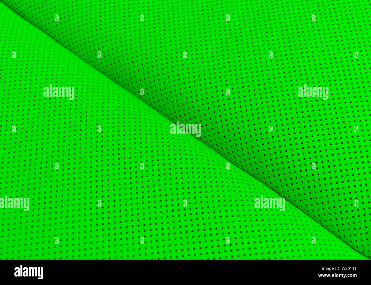 Modern luxury Car green leather interior. Part of perforated leather ...