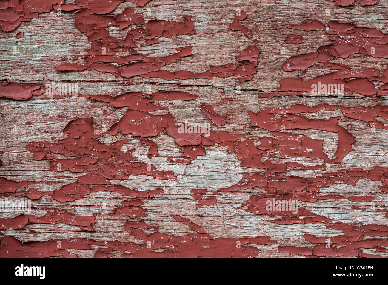 background texture of peeling red paint on weathered grey wood Stock ...