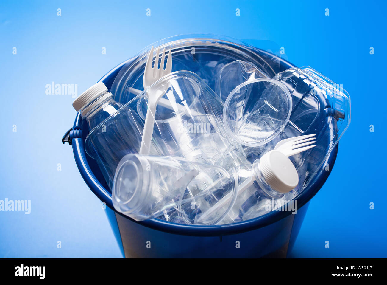 clean recyclable plastic bottles, containers, cups in garbage bin ...