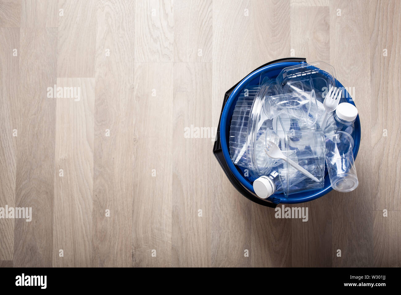 clean recyclable plastic bottles, containers, cups in garbage bin ...