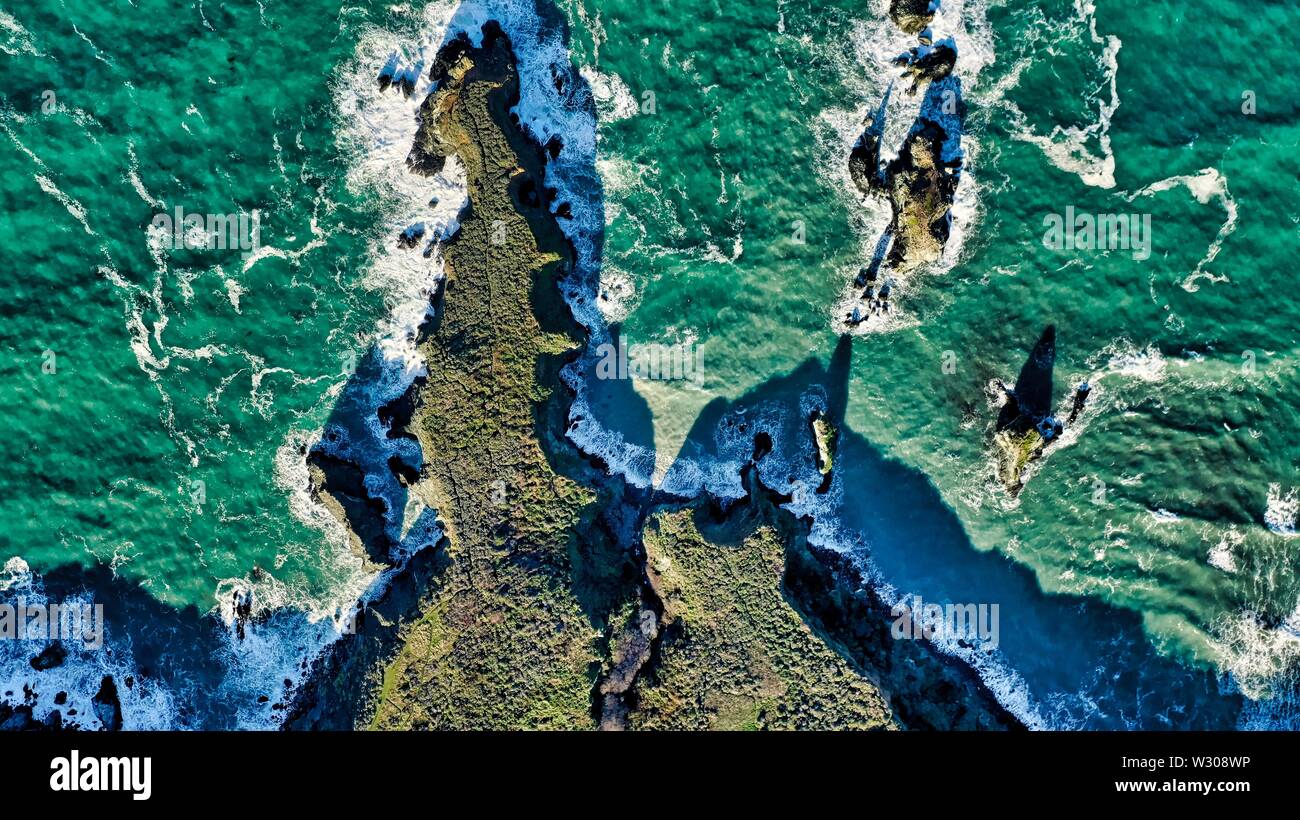 Aerial shot of beautiful coral reefs and amazing texture of the water ...