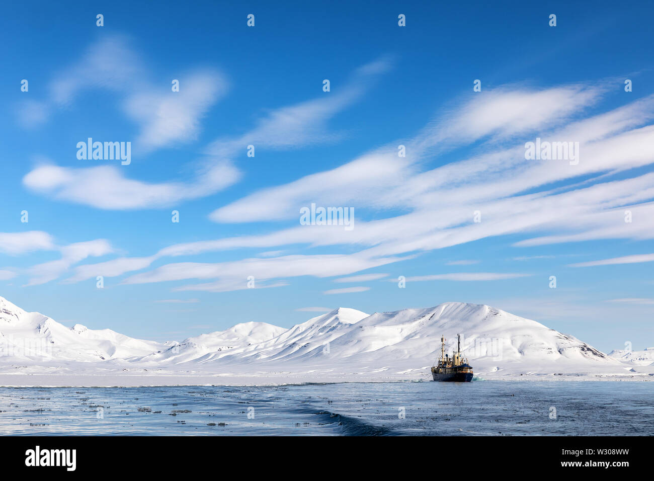 Boat on the fjords of Svalbard, a Norwegian archipelago between ...