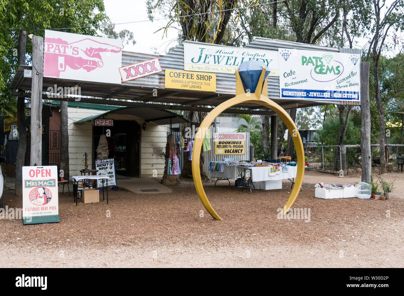 A gem shop with a giant ring with a sapphire gem as the main entrance ...