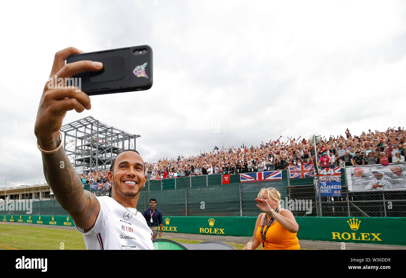 Mercedes' Lewis Hamilton takes a selfie during a preview day for the ...