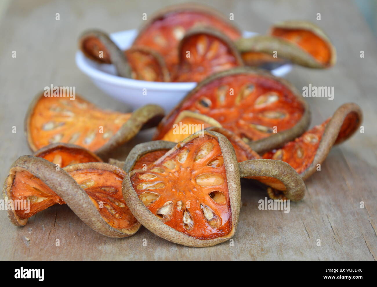 dried bael fruit on wooden board Stock Photo - Alamy