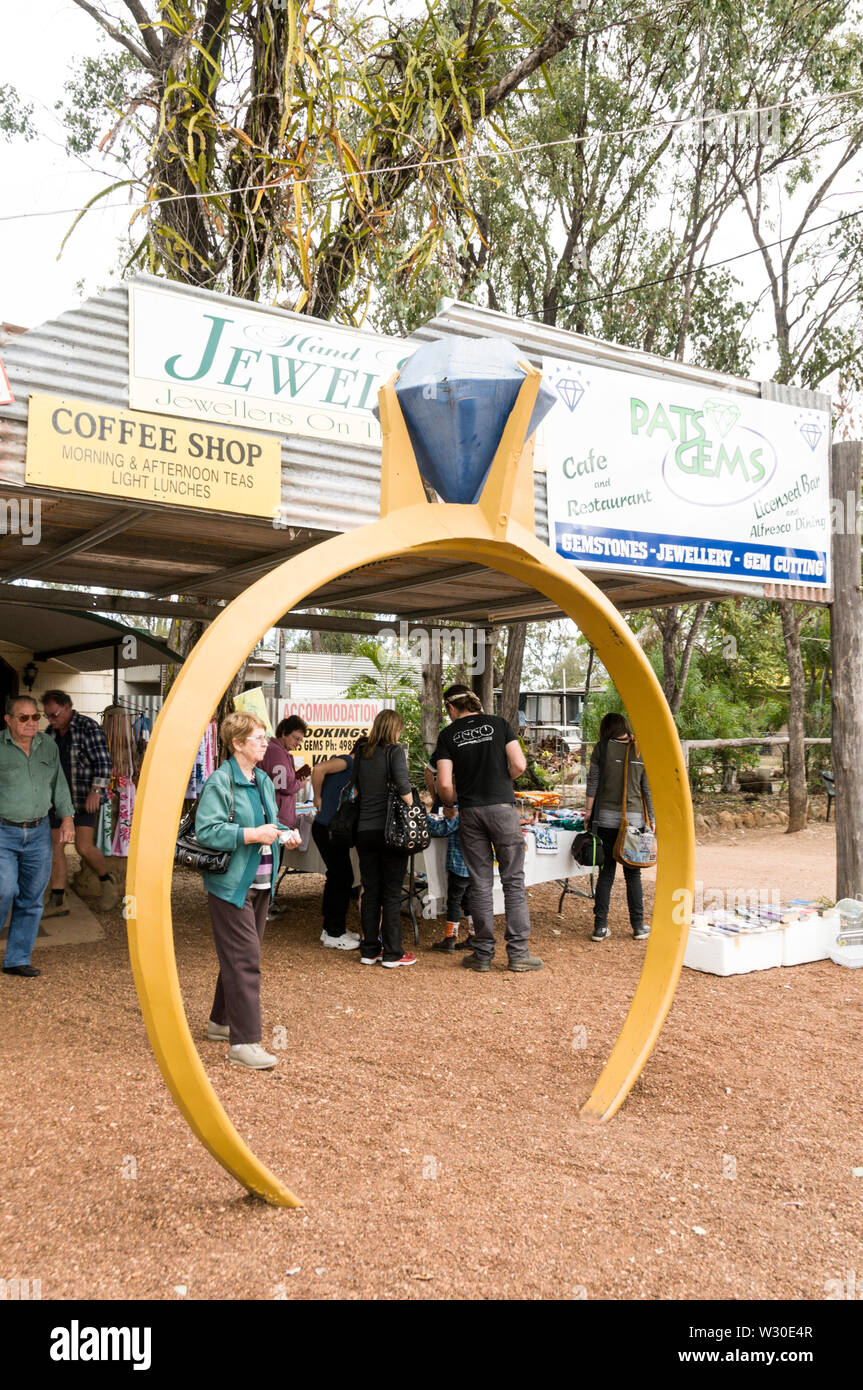 A gem shop with a giant ring with a sapphire gem as the main entrance ...