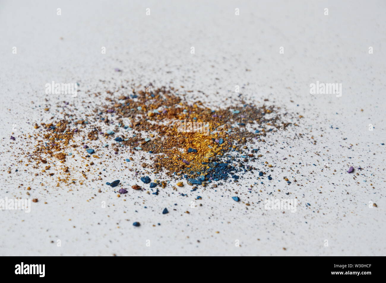 color powder spread on white paper Stock Photo - Alamy