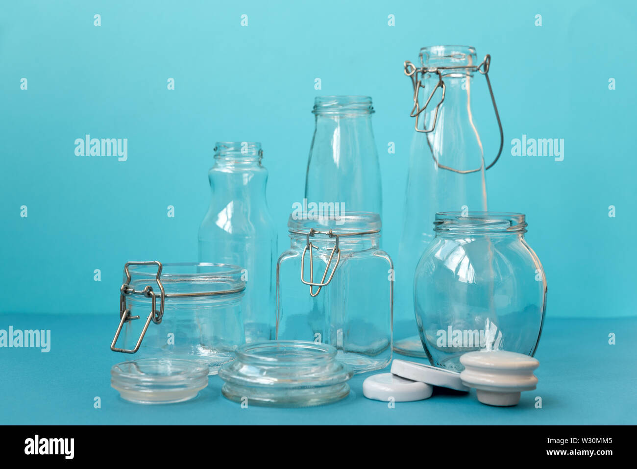 Glass jars standing on blue background. Eco friendly, reuse or zero ...