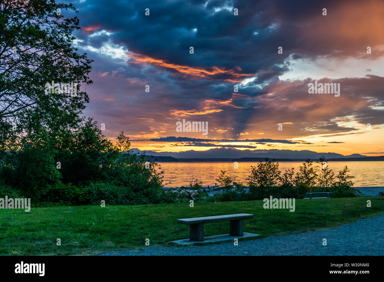 Dark clouds hang over the setting sun in the Pacific Northwest Stock ...