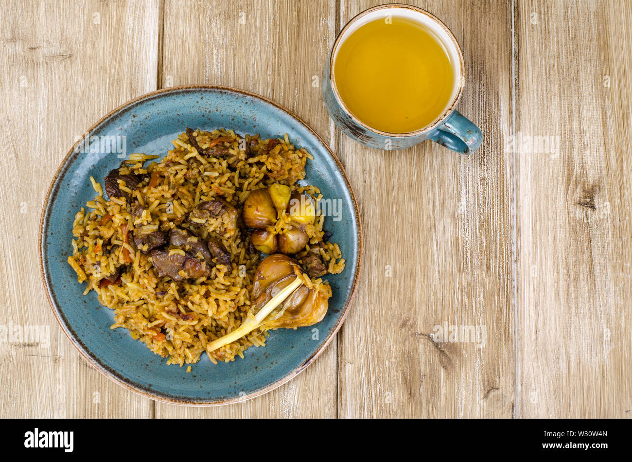 Delicious aromatic pilaf with lamb and garlic Stock Photo - Alamy