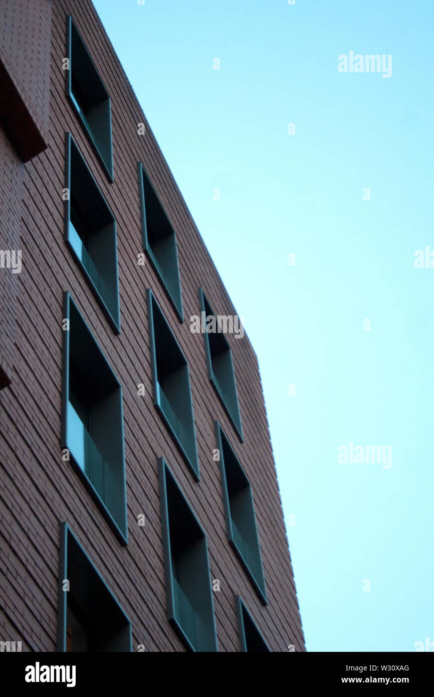 Masonry building facade detail with square windows pattern Stock Photo ...