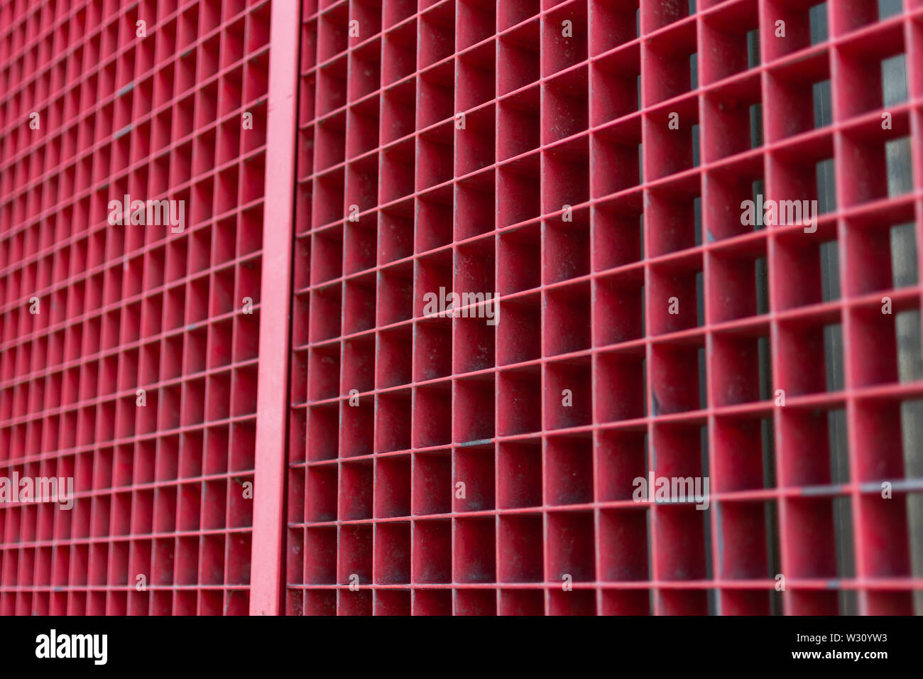 Abstract background with square red iron grid Stock Photo - Alamy