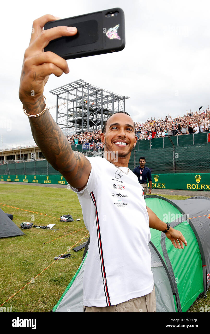 Mercedes' Lewis Hamilton takes a selfie infront of the grandstand ...