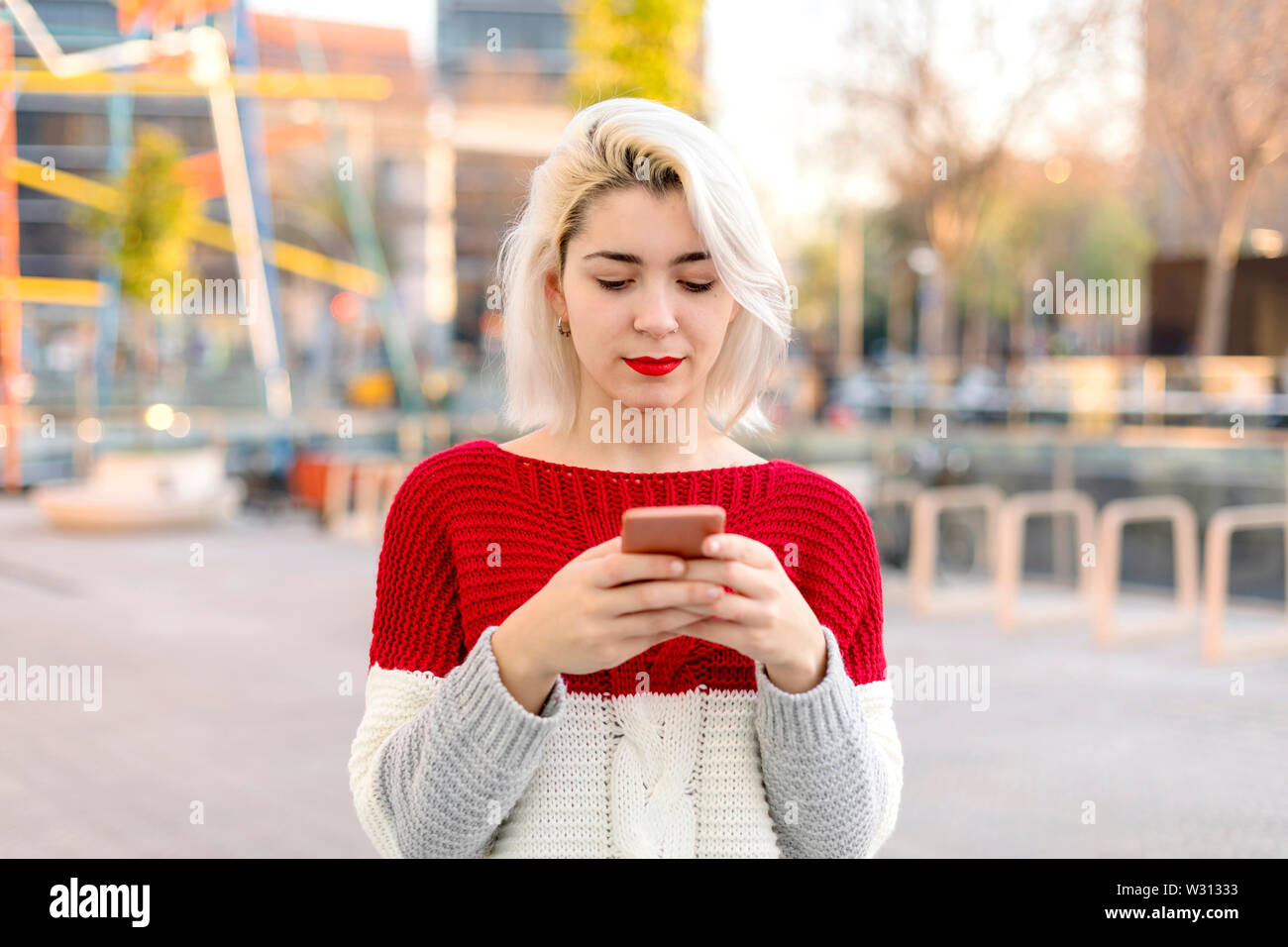 Woman sending a message Stock Photo - Alamy