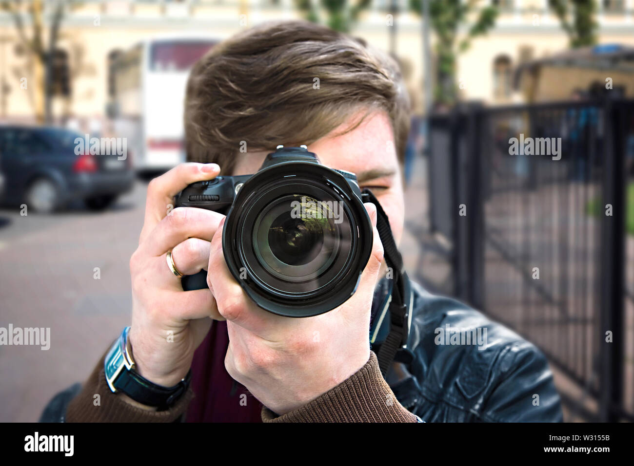 photographer takes a picture. Front view, close-up Stock Photo - Alamy