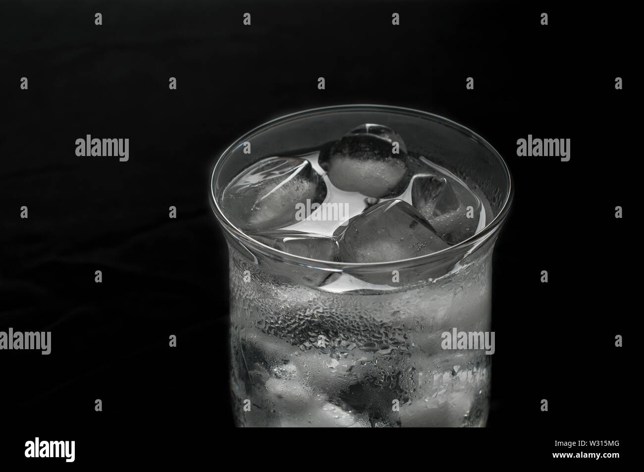 Ice water in a dark environment, low key light photography with black ...