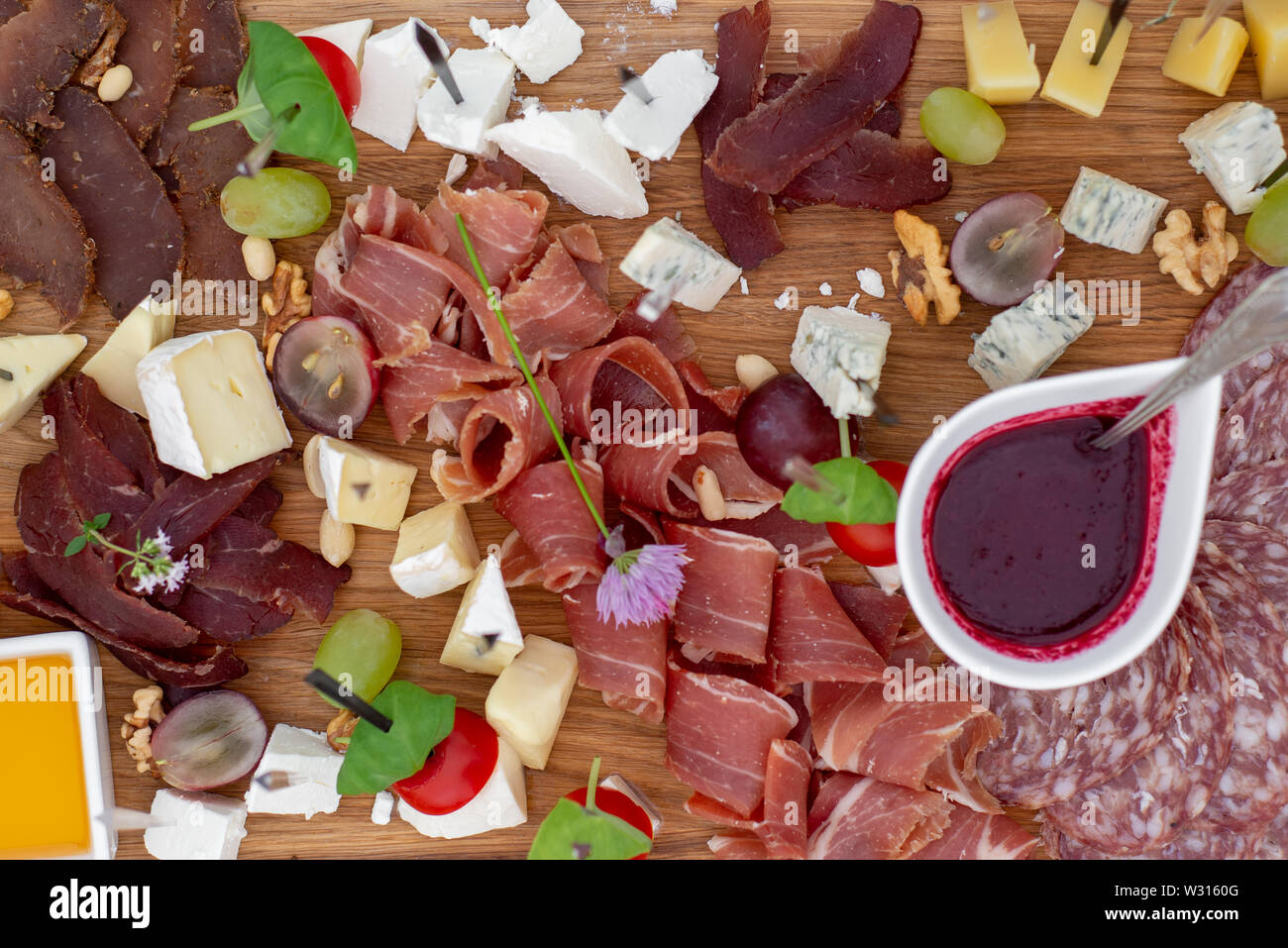 Large selection of food with cold snacks, salads, cold meats, cheese ...