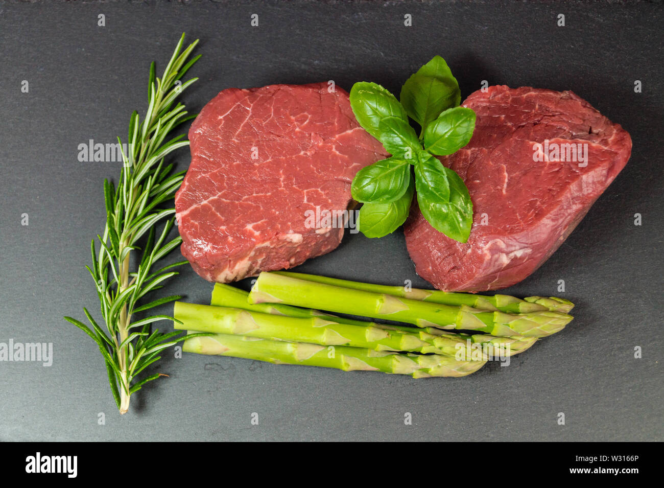 raw filet Steak with spices and vegetables Stock Photo - Alamy
