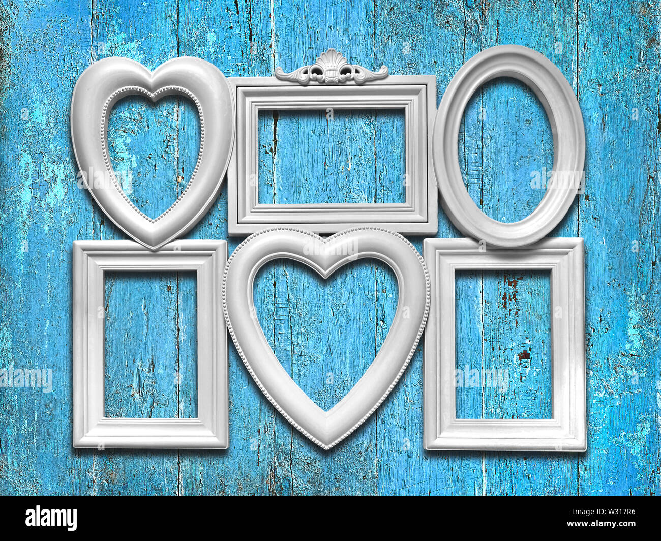 Decorative white photo frames on a blue wooden background Stock Photo ...