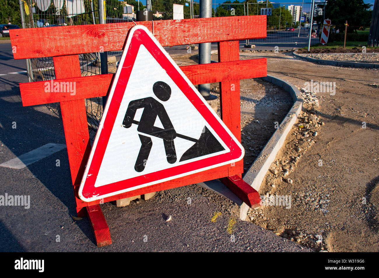 Under construction. Work in progress. Roadworks, road signs. Men at ...