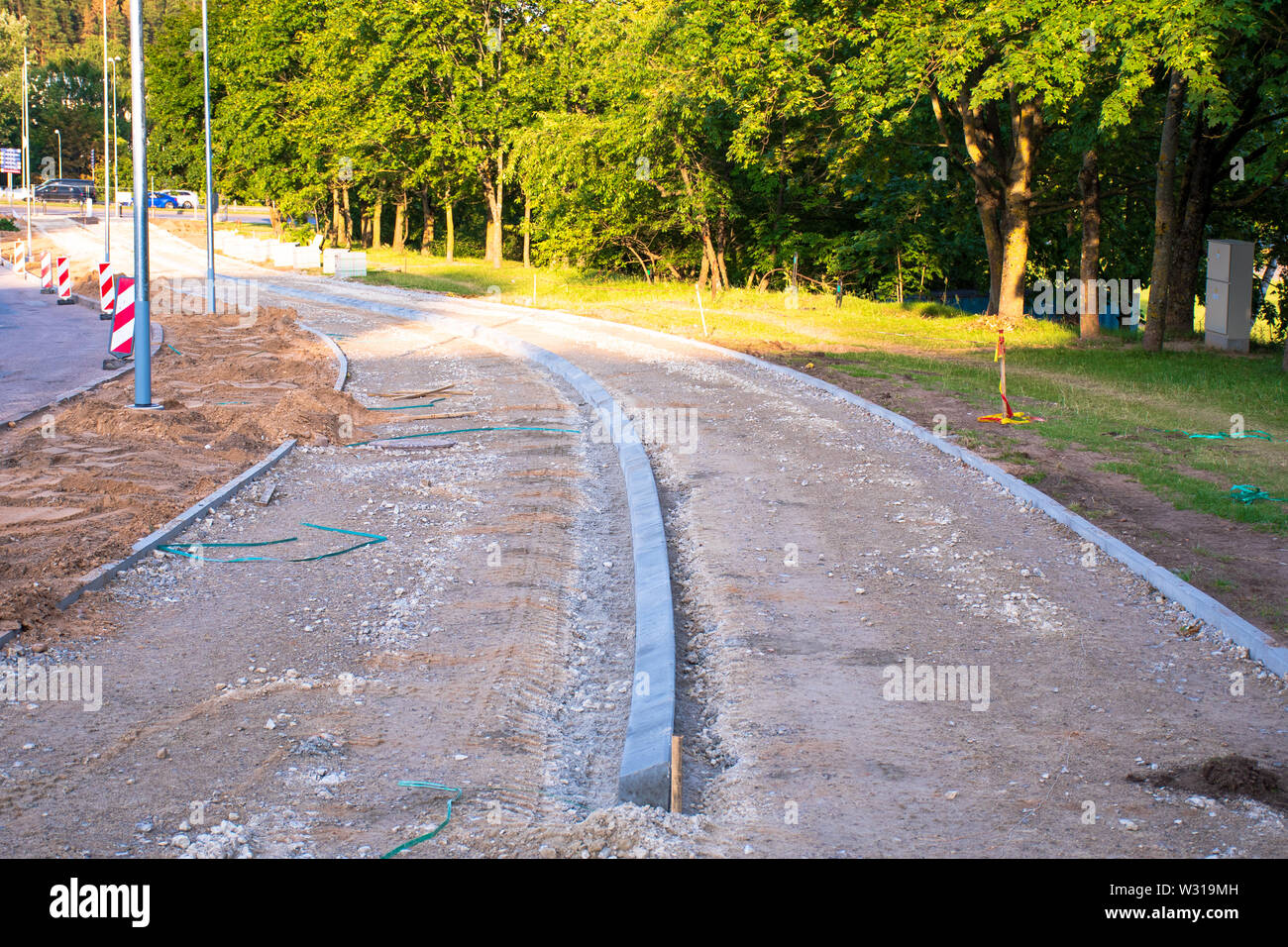Building a new bike path with sidewalk, bicycle road under construction ...