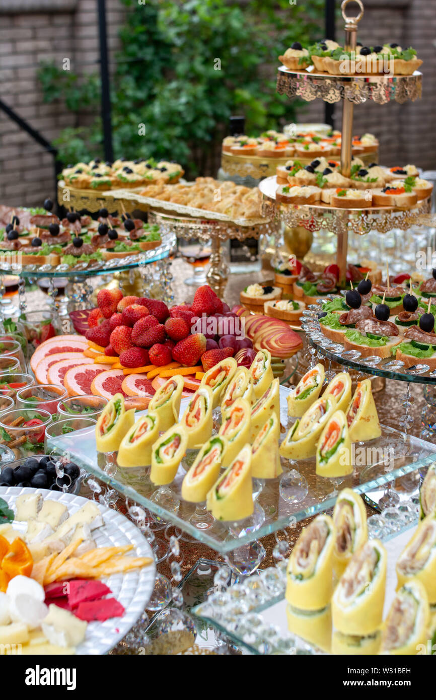 Large selection of food with cold snacks, meat and salads, fruit, cold ...