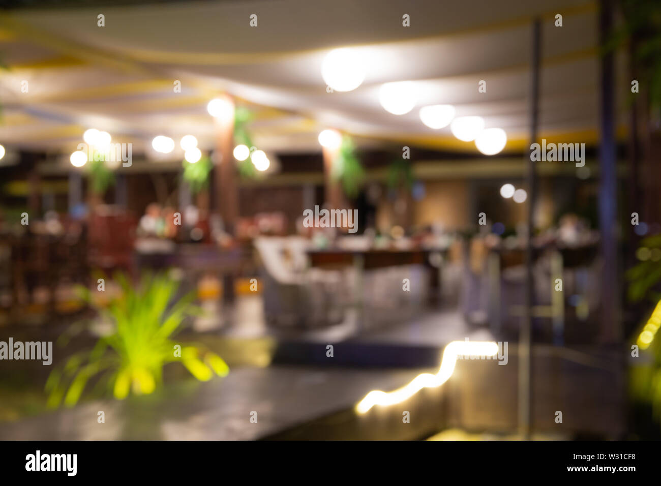 Blur light reflection on scene at restaurant, pub or bar at night ...