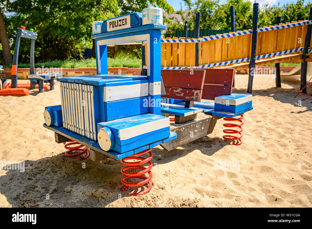 Various wooden playground equipment on a public playground in Berlin ...
