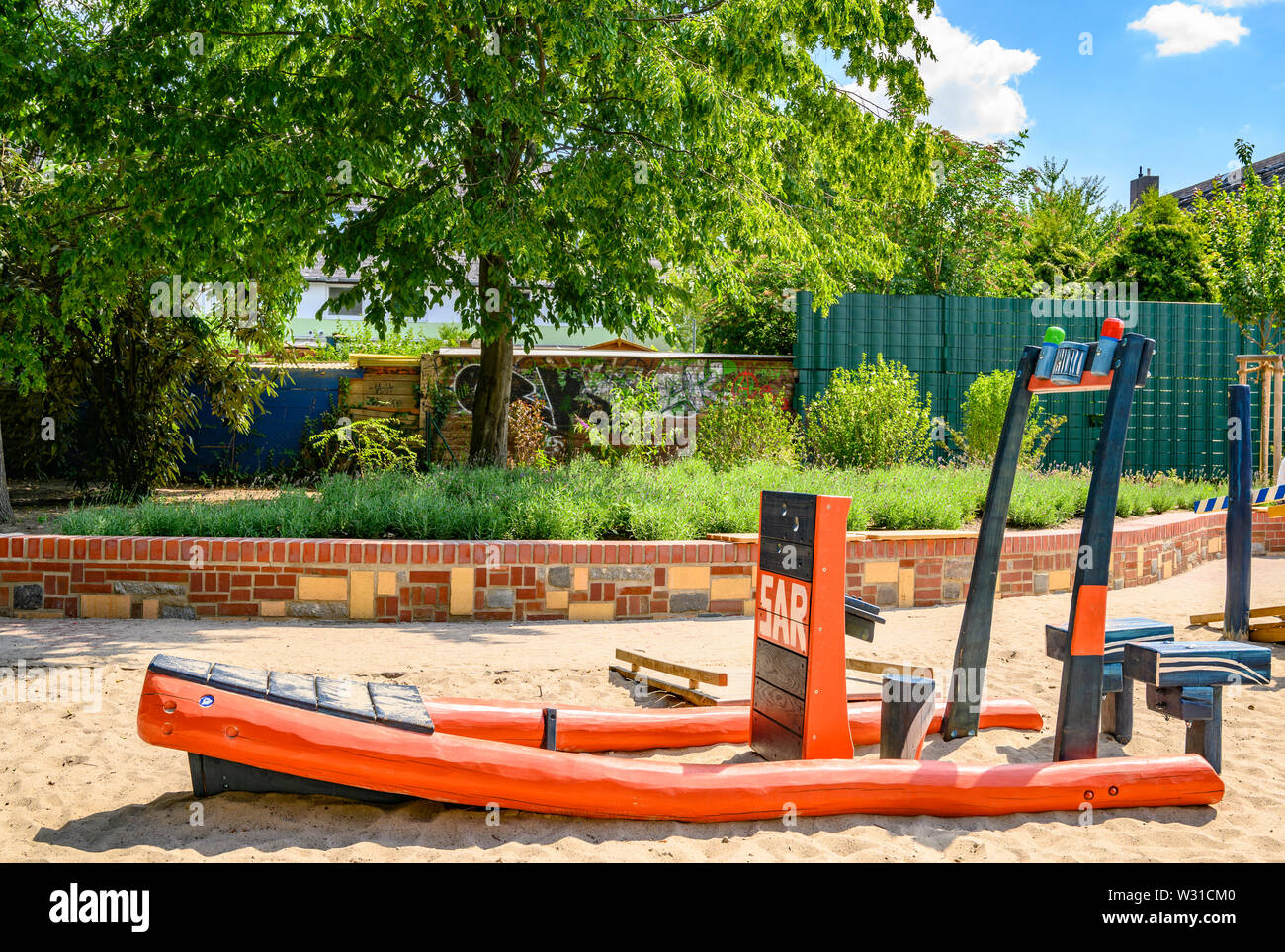 Berlin, Germany - July 11, 2019: Various wooden playground equipment on ...